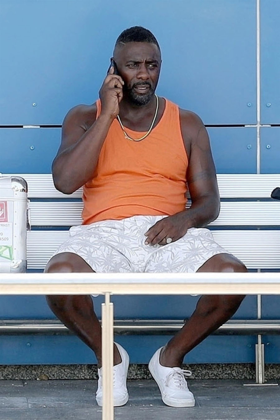 British actor Idris Elba is pictured in character while filming at the ...