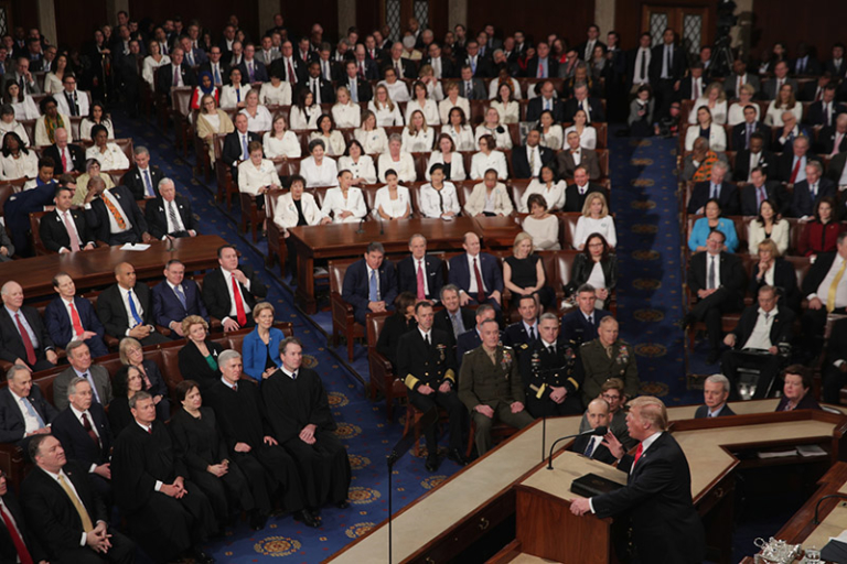 Female lawmakers dressed in white watch as President Donald Trump ...