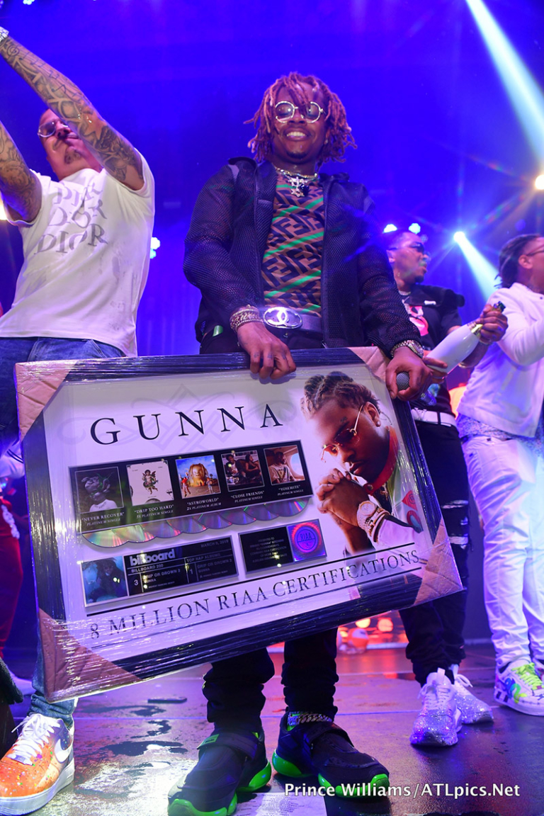 Gunna accepts a platinum plaque issued by RIAA that signifies 8 million ...