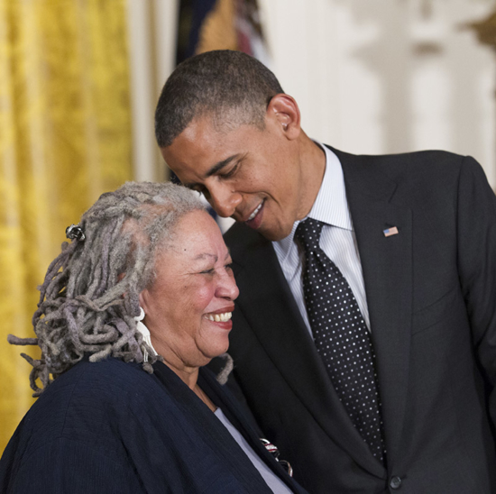 U.S. President Barack Obama whispers to novelist Toni Morrison as he ...