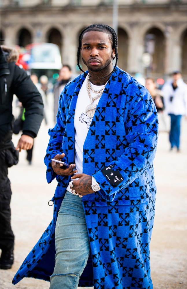 Rapper Pop Smoke, wearing a blue Off-White coat, is seen outside the ...