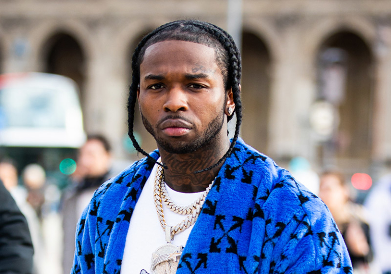 Rapper Pop Smoke, wearing a blue Off-White coat, is seen outside the ...