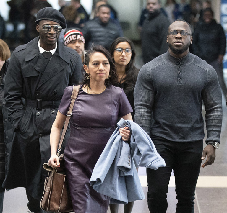 Attorney Gloria Schmidt Rodriguez (center) with Abimbola (L) and Ola ...