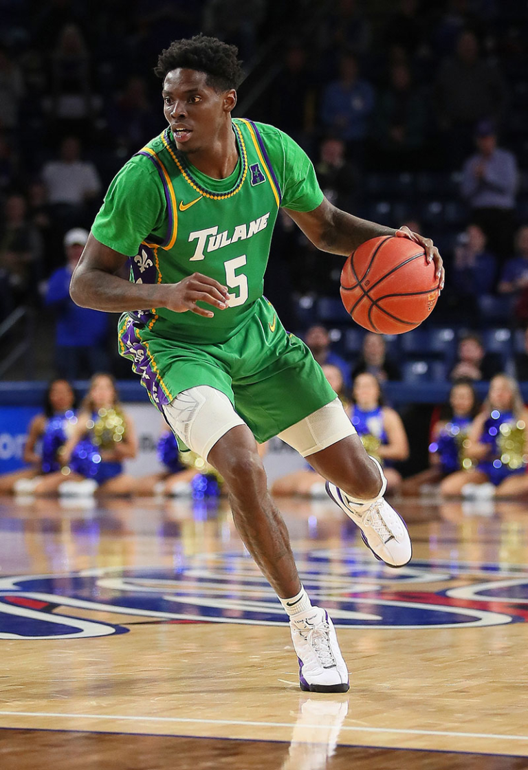 Tulane Green Wave Guard Teshaun Hightower (5) dribbles during a college ...