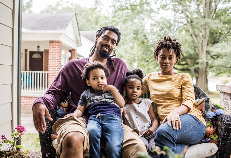 Stock Portrait of family in front of suburban home. Photo by MoMo ...