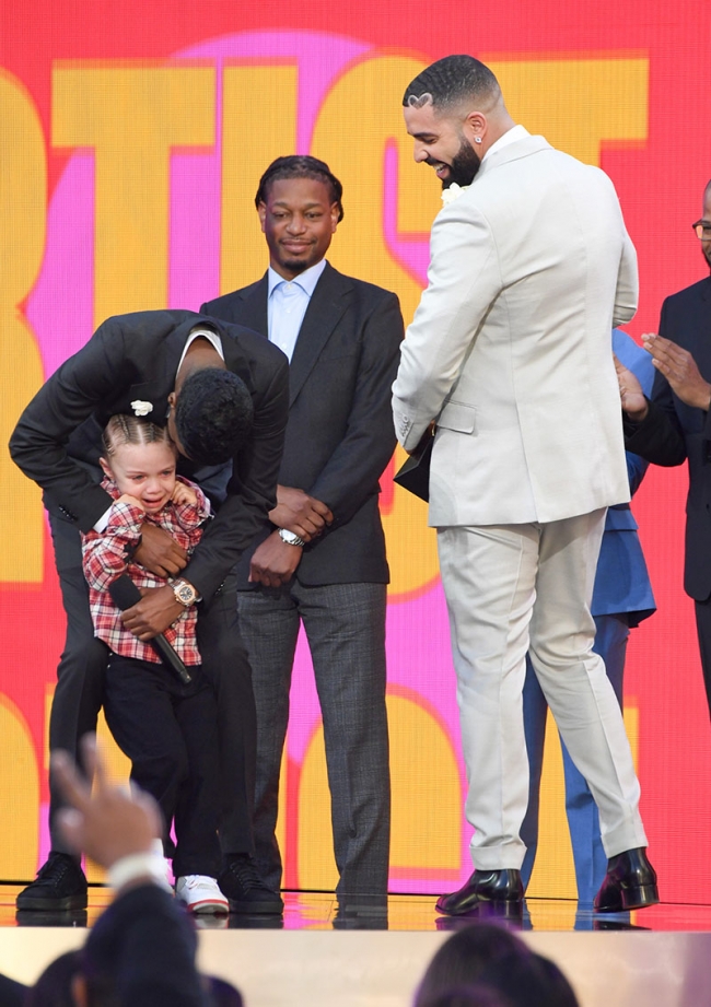 (L-R) Adonis Graham, CJ Gibson, and Drake speak onstage as he accepts ...