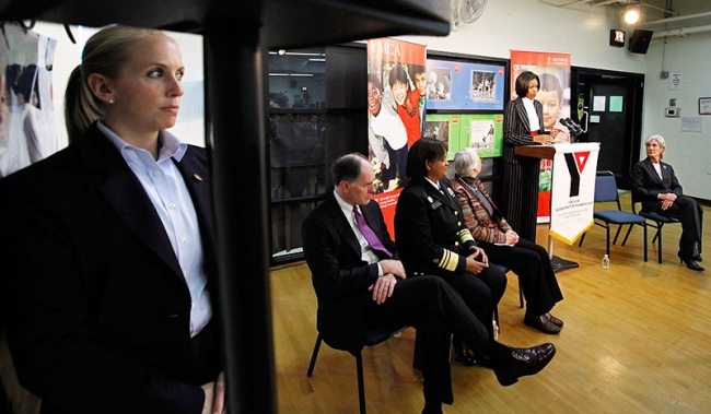 Secret Service agent watches as First lady Michelle Obama speaks about ...