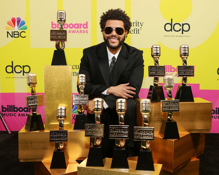The Weeknd, winner of the Top Artist Award, Top Male Artist Award, Top ...