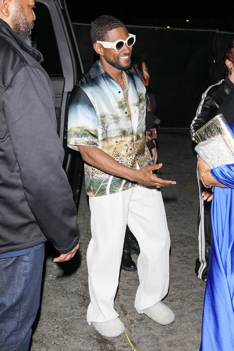 Usher is in good spirits exiting the Interscope roller skating event in ...