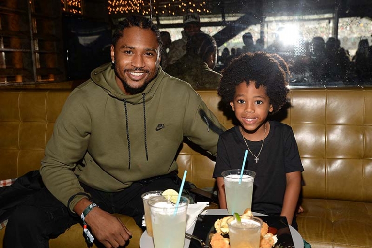 EAST RUTHERFORD, NEW JERSEY – SEPTEMBER 29: (L-R) Trey Songz and son ...