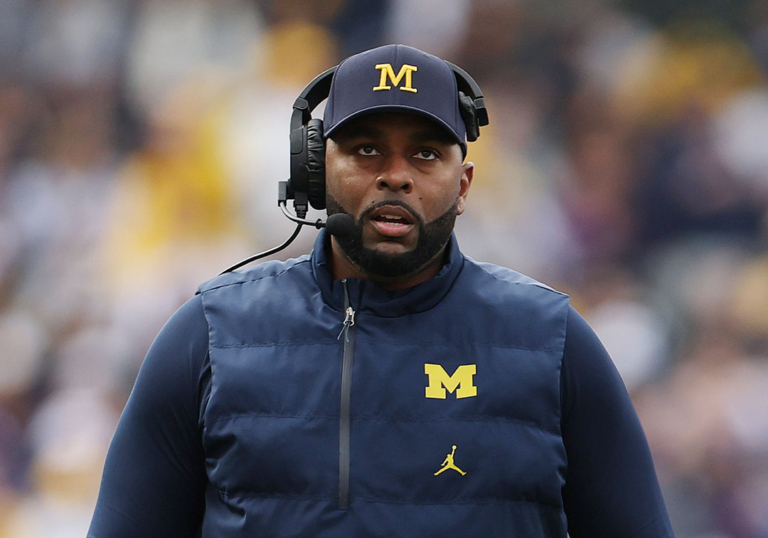 Michigan football head coach detained by police after he was fired for ...